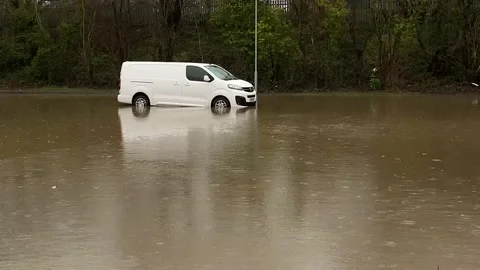 Van stuck in a flooded car park on a wet... | Stock Video | Pond5