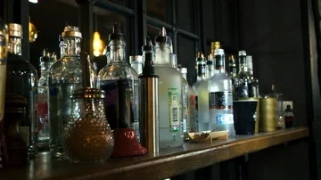 Various alcohol bottles in a bar, back l... | Stock Video | Pond5
