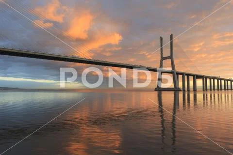 Vasco da Gama Bridge landscape at sunrise. One of the longest bridges ...