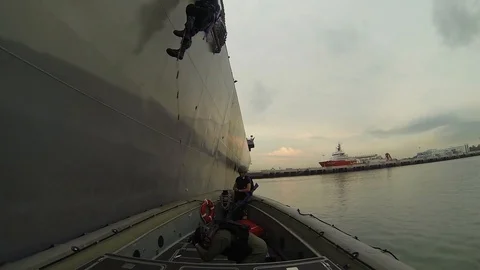 VBSS crew members climb down on rigid hu... | Stock Video | Pond5