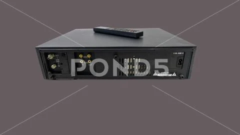 VCR with old VHS tapes and remote control -- Stock Photo #280923685