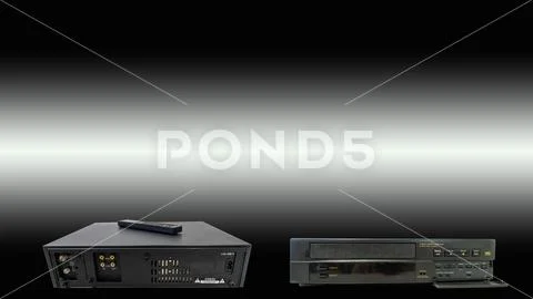 VCR with old VHS tapes and remote control -- Stock Photo #280923905