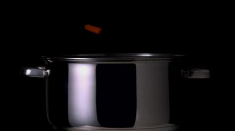 Vegetables falling into pot on black bac... | Stock Video | Pond5