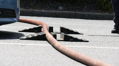 Vehicles drive across ramp over fire fig... | Stock Video | Pond5