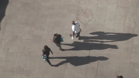Verical aerial view of People walk cast ... | Stock Video | Pond5
