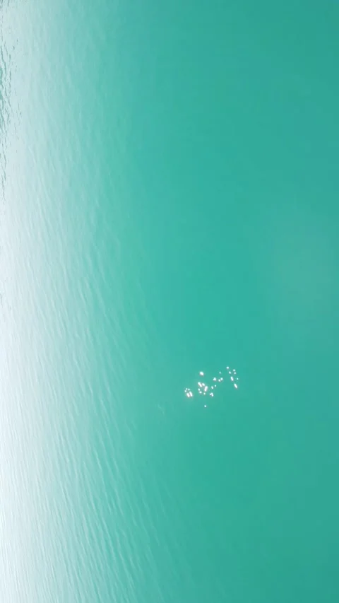 Vertical aerial view on sea water surfac... | Stock Video | Pond5