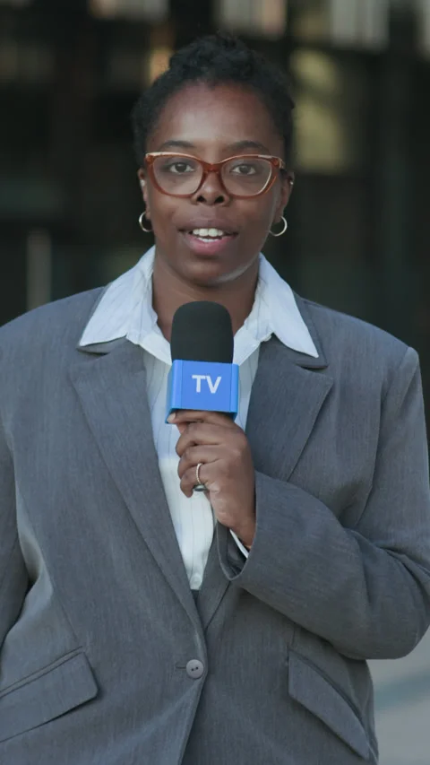 Vertical of Black Female TV Reporter Cov... | Stock Video | Pond5