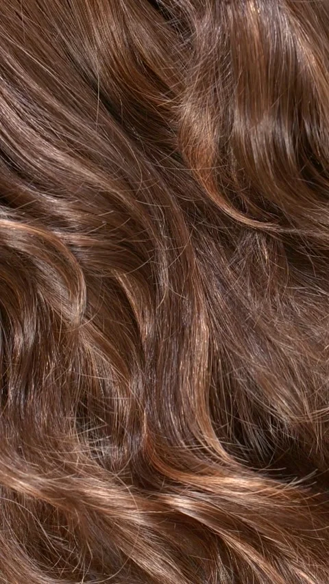 Vertical brown curly hair texture, close... | Stock Video | Pond5