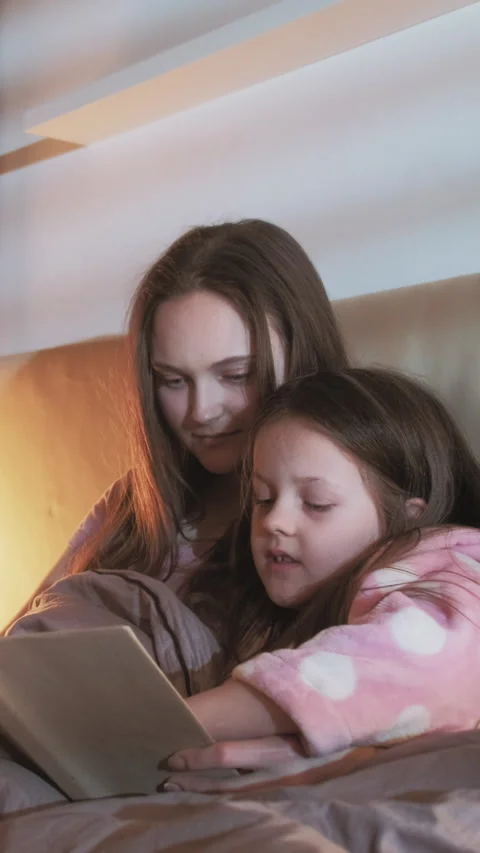 Vertical child reading family evening mo... | Stock Video | Pond5