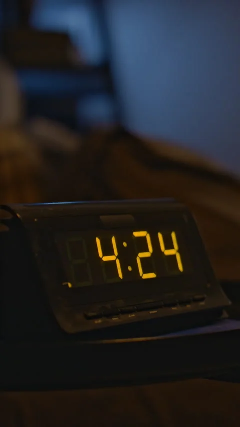 Vertical of Digital Clock on Nightstand ... | Stock Video | Pond5