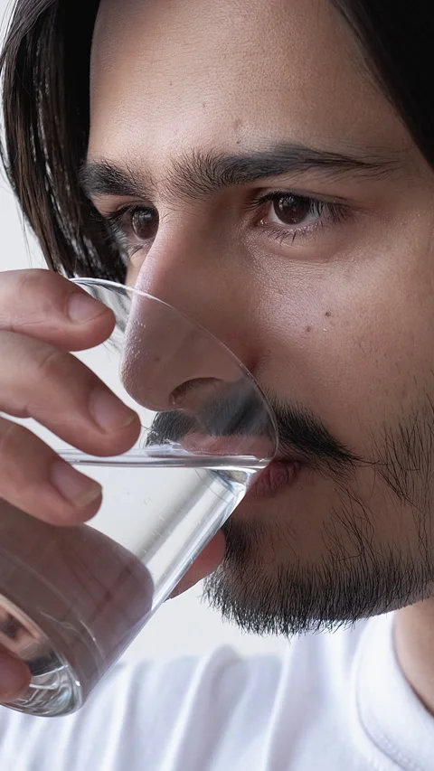 Vertical drinking water aqua balance guy... | Stock Video | Pond5