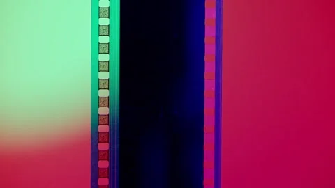 Vertical film strip on a pink and white ... | Stock Video | Pond5
