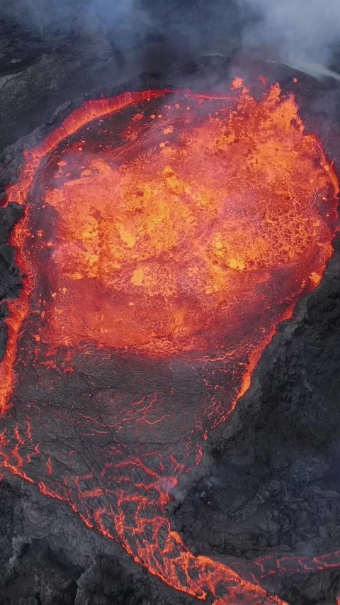 Vertical footage of erupting lava at a v... | Stock Video | Pond5