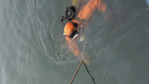 Vertical footage scuba diver in orange d... | Stock Video | Pond5
