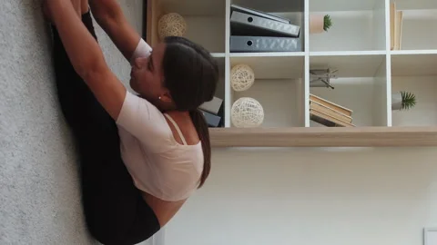 Vertical forward fold stretching coach w... | Stock Video | Pond5
