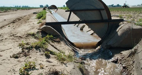 Vertical gate on cement irrigation ditch... | Stock Video | Pond5
