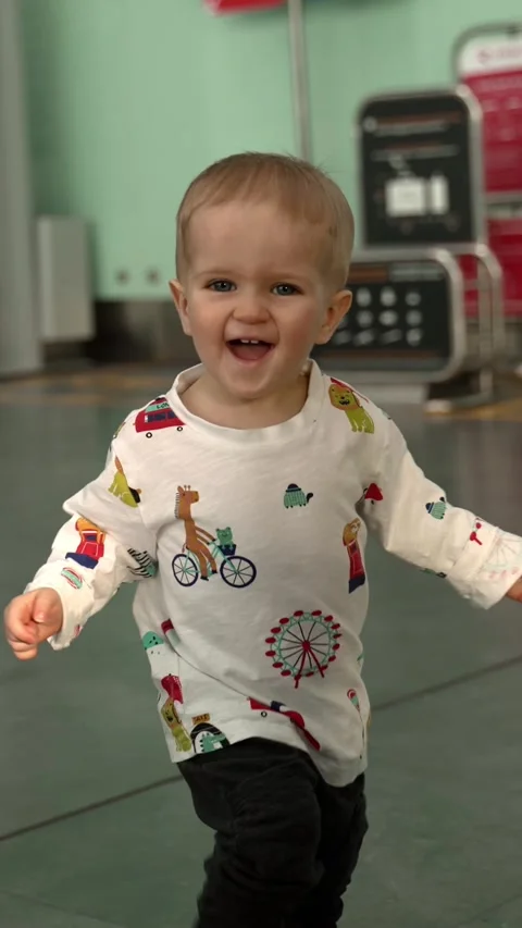 Vertical of Happy kid running at camera ... | Stock Video | Pond5