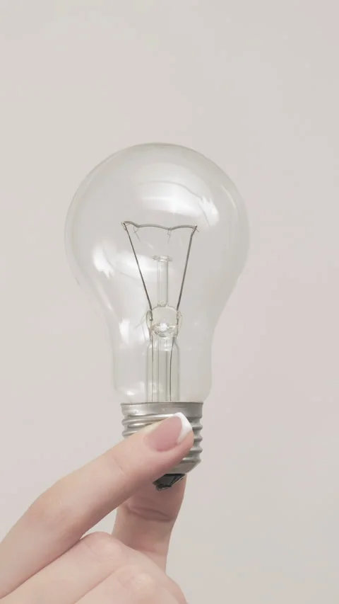 Vertical illumination bulb idea lamp fem... | Stock Video | Pond5