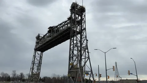 Vertical lift bridge slowly lowering bac... | Stock Video | Pond5