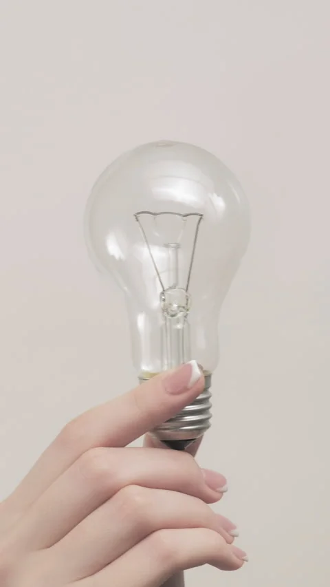 Vertical light bulb creative idea female... | Stock Video | Pond5