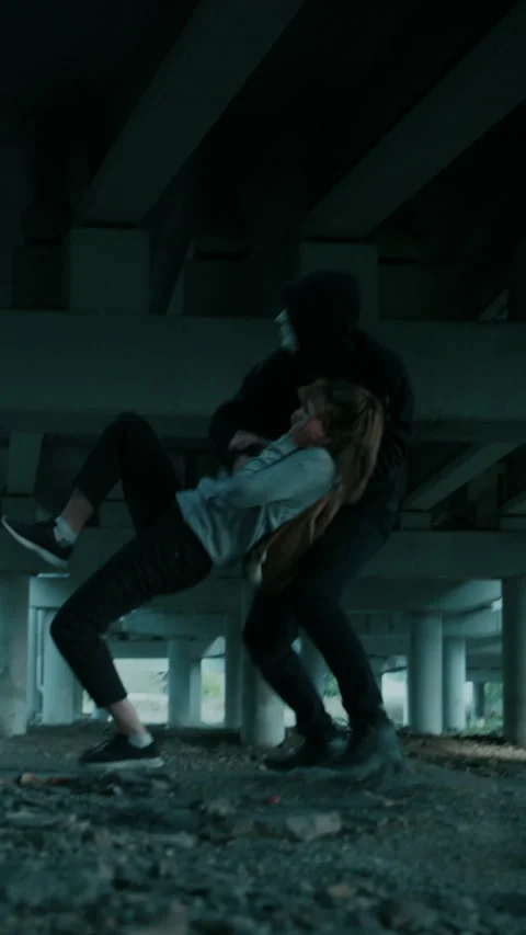 Vertical of Man Chasing and Abducting Yo... | Stock Video | Pond5