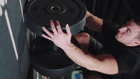 Vertical Screen: Bodybuilder carrying ba... | Stock Video | Pond5