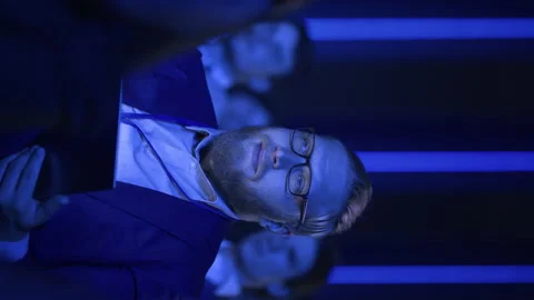 Vertical Screen Male Sitting at Crowded ... | Stock Video | Pond5