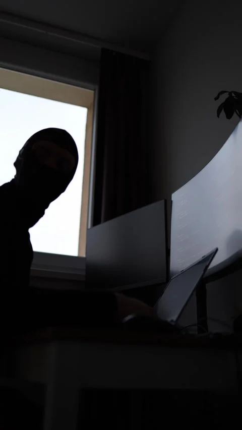 Vertical screen: A shadowy figure in a h... | Stock Video | Pond5