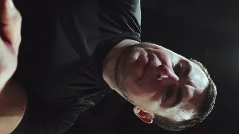 Vertical Screen: Strong man doing biceps... | Stock Video | Pond5