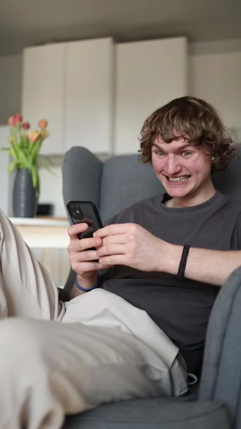 Vertical screen: Young man with an awkwa... | Stock Video | Pond5