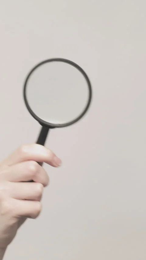 Vertical searching loupe detective glass... | Stock Video | Pond5