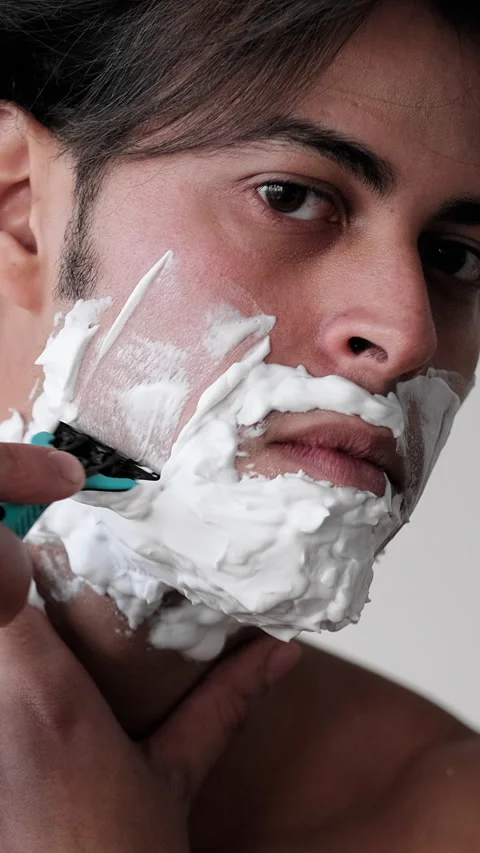 Vertical shaving face morning grooming g... | Stock Video | Pond5