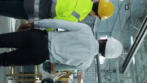 Vertical shoot. Full height engineers go... | Stock Video | Pond5