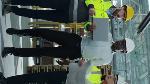 Vertical shoot. Multicultural workers wa... | Stock Video | Pond5