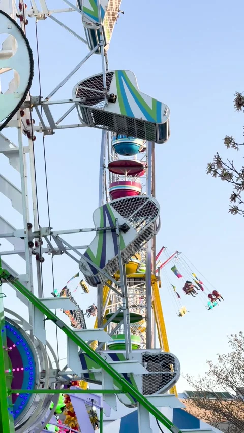 Vertical shot of carnival rides in motio... | Stock Video | Pond5