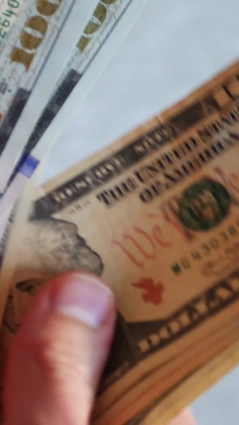 Vertical. A stack of crisp, dollar bills... | Stock Video | Pond5