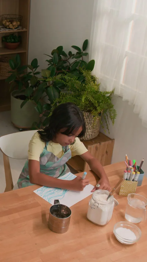 Vertical Top View of Little Girl Drawing... | Stock Video | Pond5