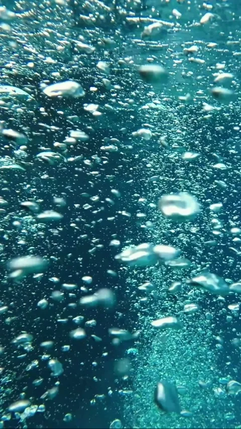 VERTICAL VIDEO, Air bubbles flow rises i... | Stock Video | Pond5