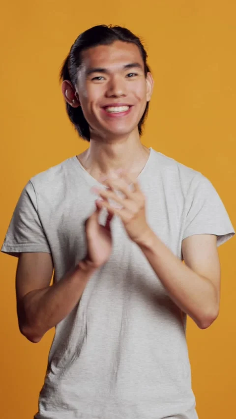 Vertical video: Asian man clapping hands... | Stock Video | Pond5