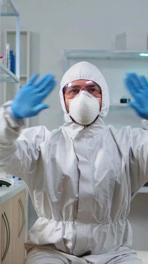Vertical video: Lab technician in ppe su... | Stock Video | Pond5