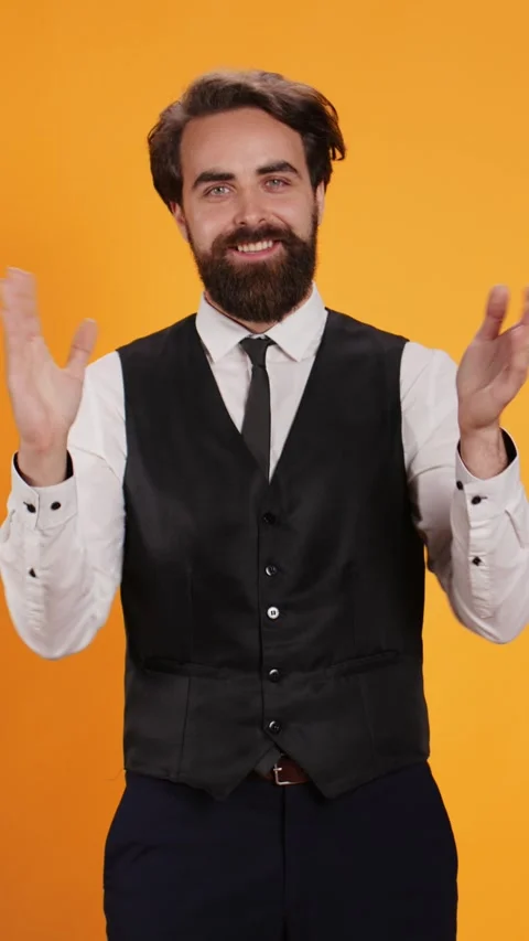 Vertical video Positive butler clapping ... | Stock Video | Pond5