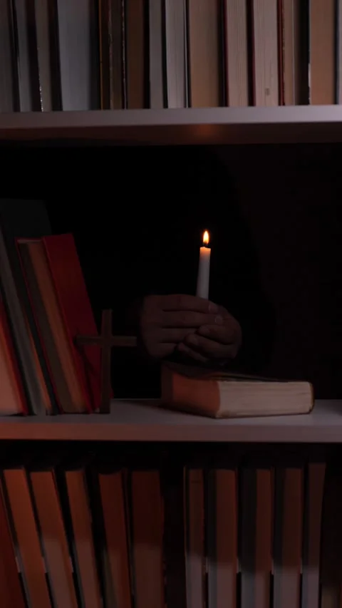 vertical video Praying hands holding a l... | Stock Video | Pond5