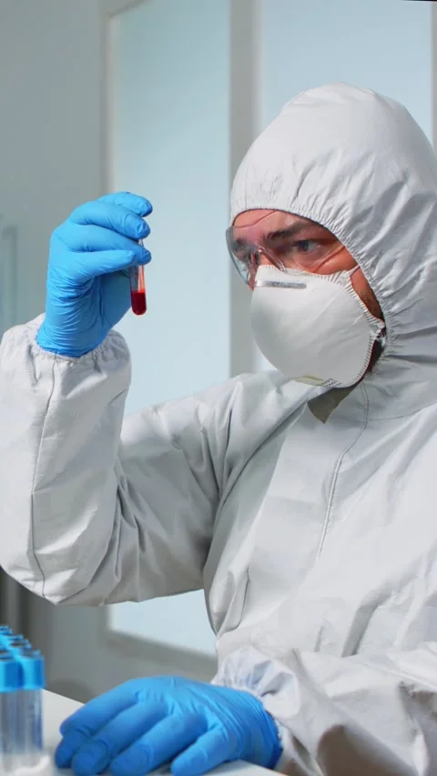 Vertical video: Scientist in sterile che... | Stock Video | Pond5