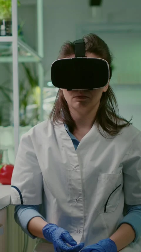 Vertical video: Scientist woman research... | Stock Video | Pond5