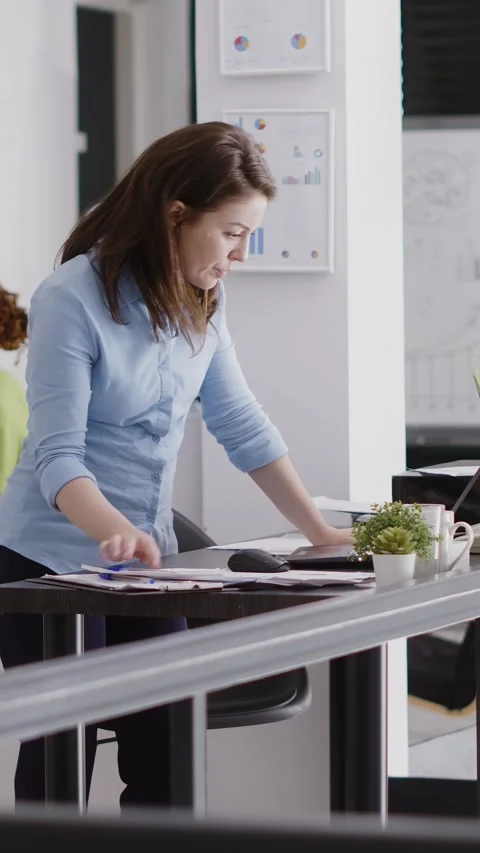 Vertical video: Startup employee plannin... | Stock Video | Pond5