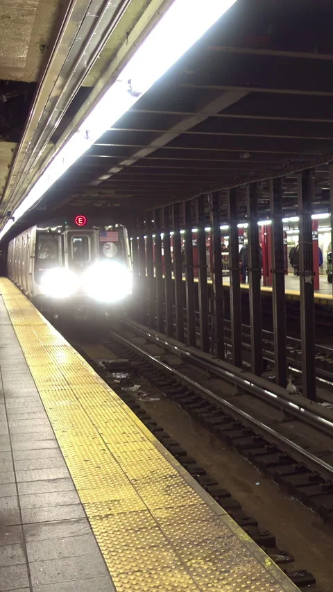 Vertical video of Subway arriving at a m... | Stock Video | Pond5