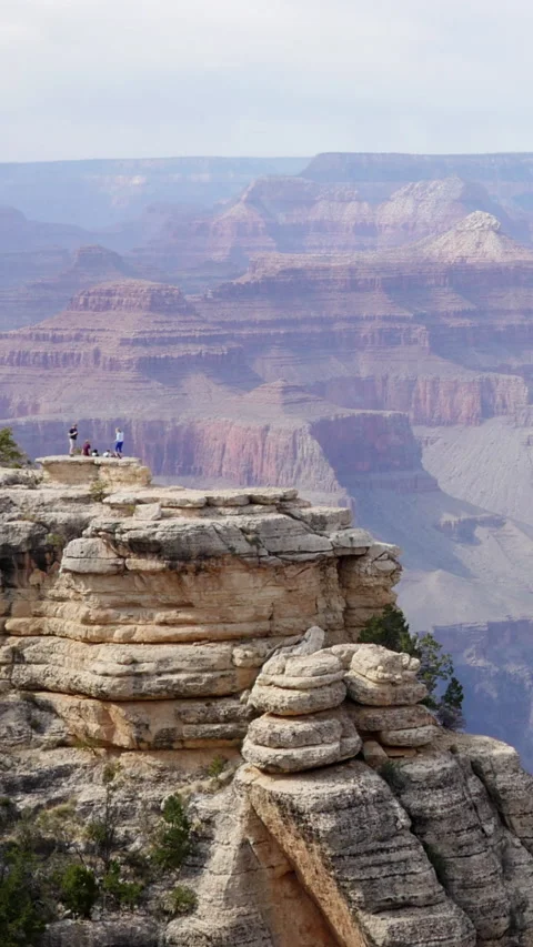 Vertical Video Tourists on Cliff at Gran... | Stock Video | Pond5