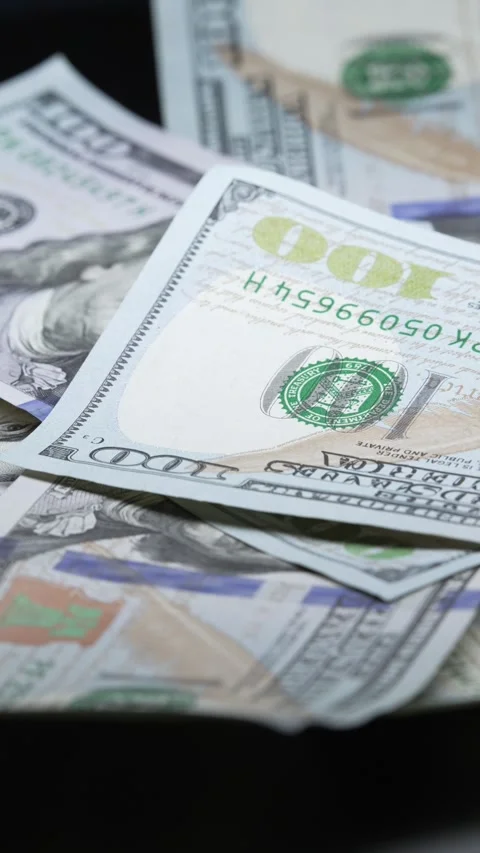 Vertical video of US currency - dollars ... | Stock Video | Pond5