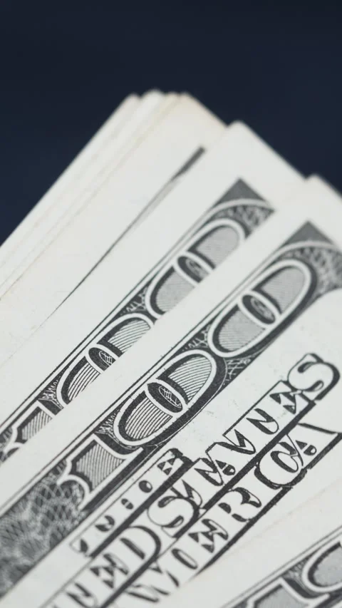 Vertical video of US currency - dollars ... | Stock Video | Pond5