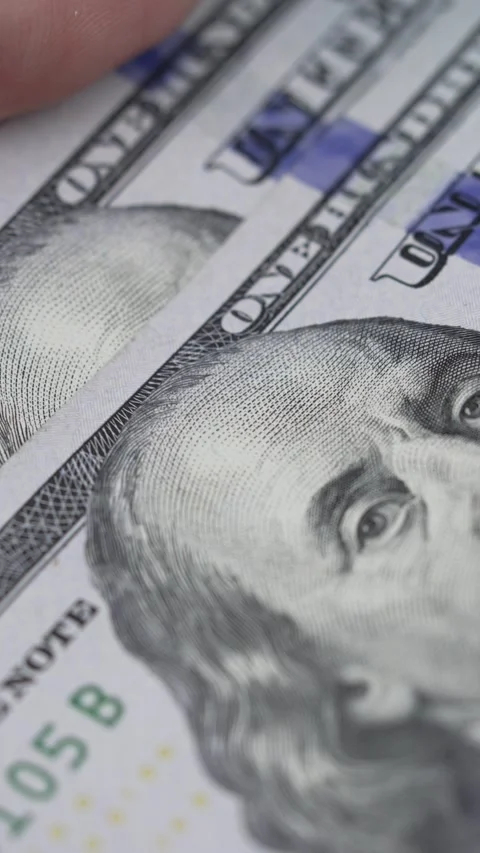 Vertical video of US currency - dollars ... | Stock Video | Pond5